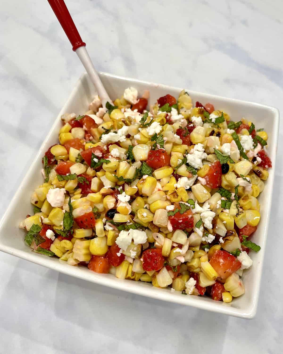 Grilled Corn Salad with Strawberries, Feta & Mint - The BakerMama