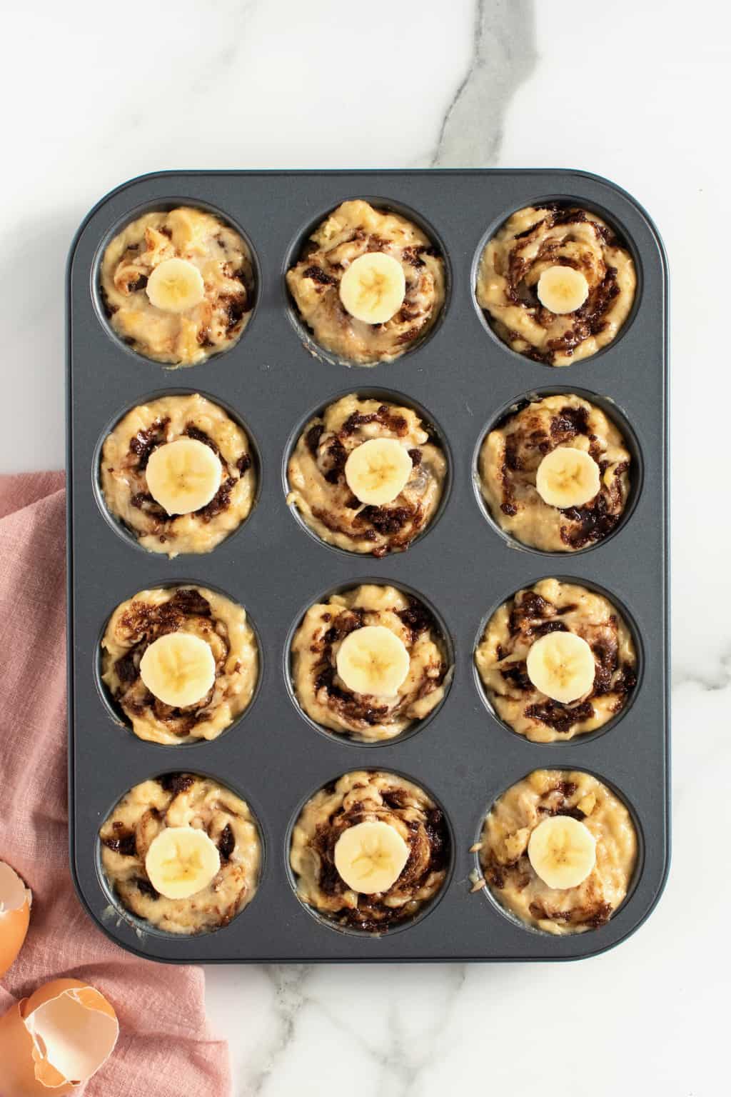 Cinnamon Swirled Banana Muffins - The BakerMama